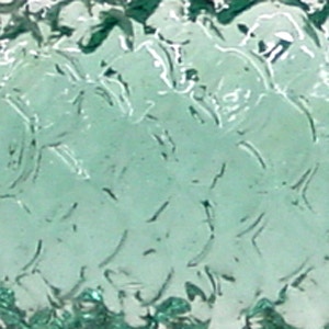 Hand-cast recycled glass fish sits loose on a wrought iron silver ...