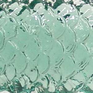 Hand-cast recycled glass fish sits loose on a wrought iron silver ...