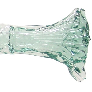 Hand-cast recycled glass fish sits loose on a wrought iron silver ...