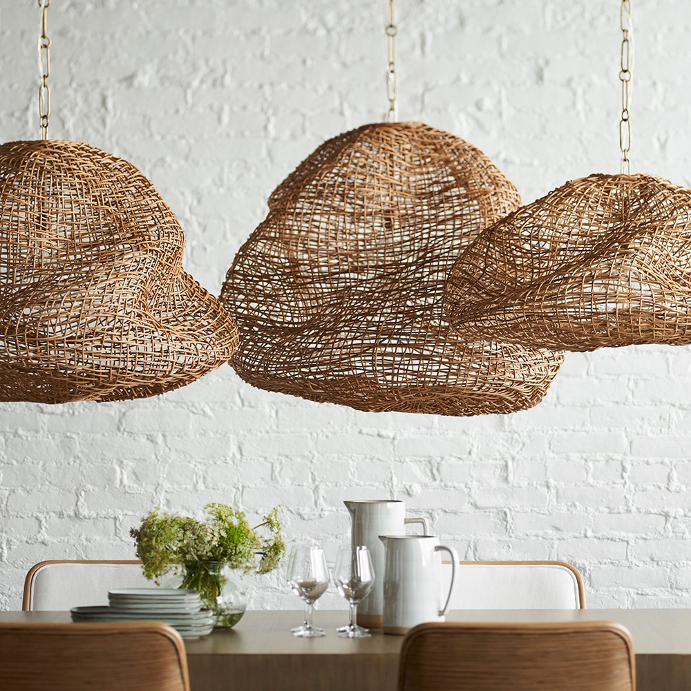 Split rattan open weave in a natural finish hand-formed over a metal frame. Pendant comes with an